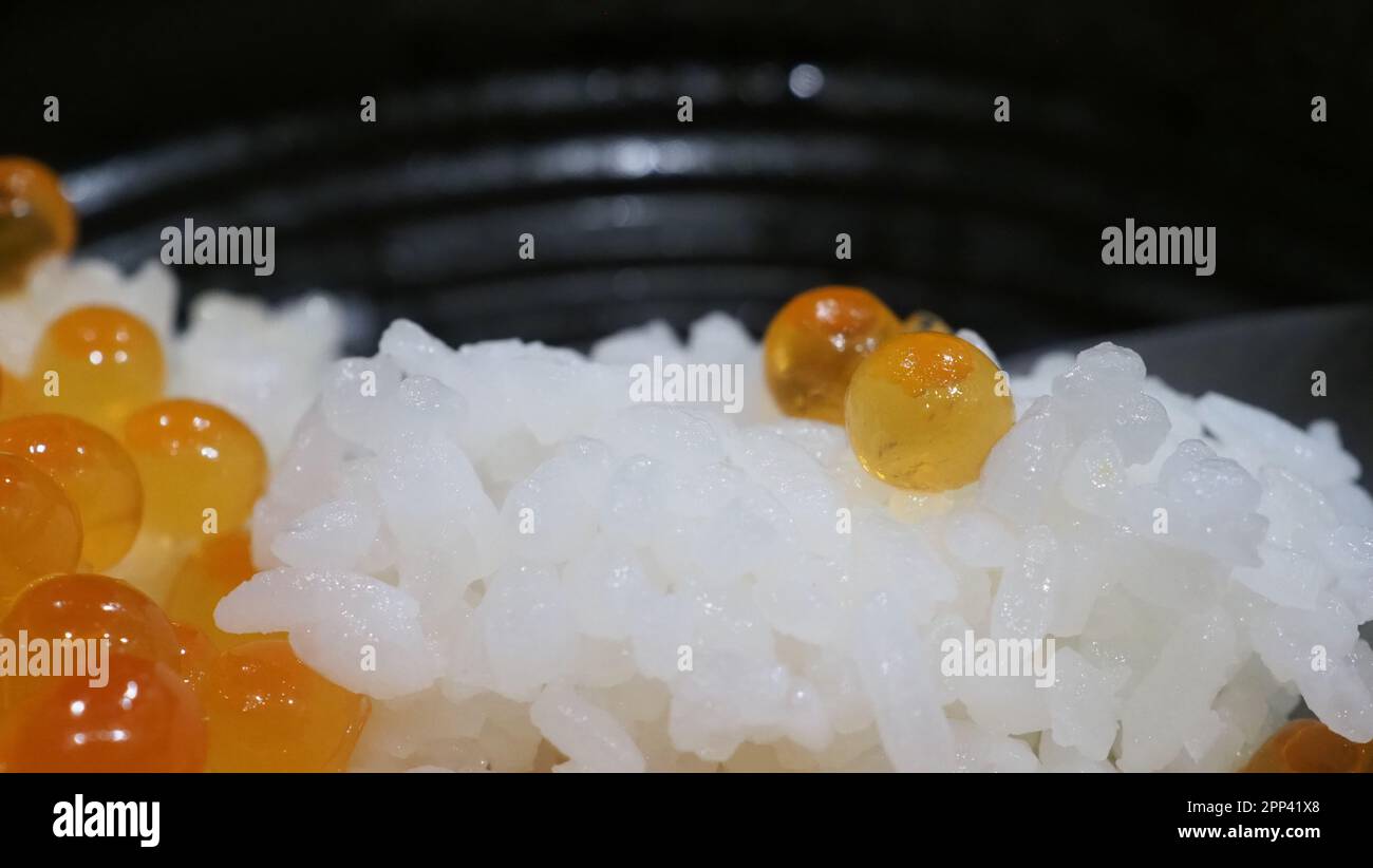 Close up of sashimi salmon roe with rice bowl or donburi in Japanese ...