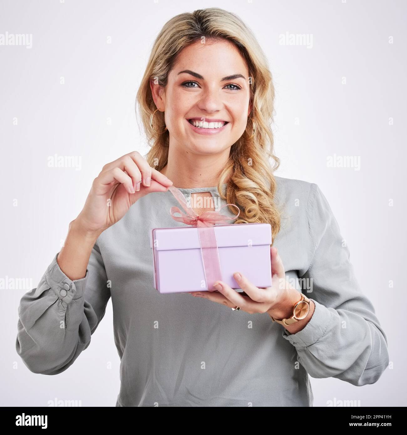 Woman, portrait and open gift box with ribbon, smile and hand holding ...