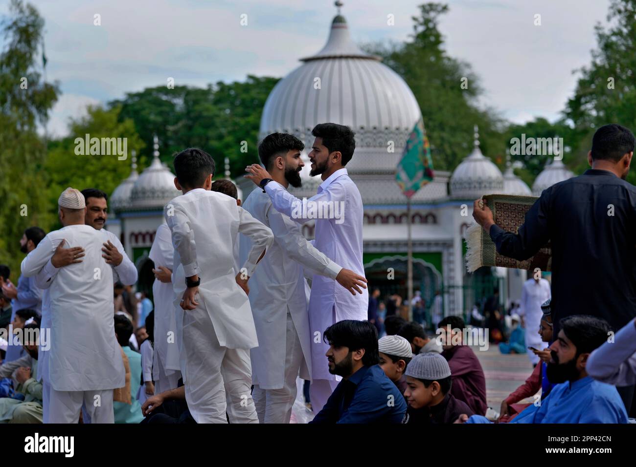 Muslims hug each others to share Eid greeting after performing Eid al ...