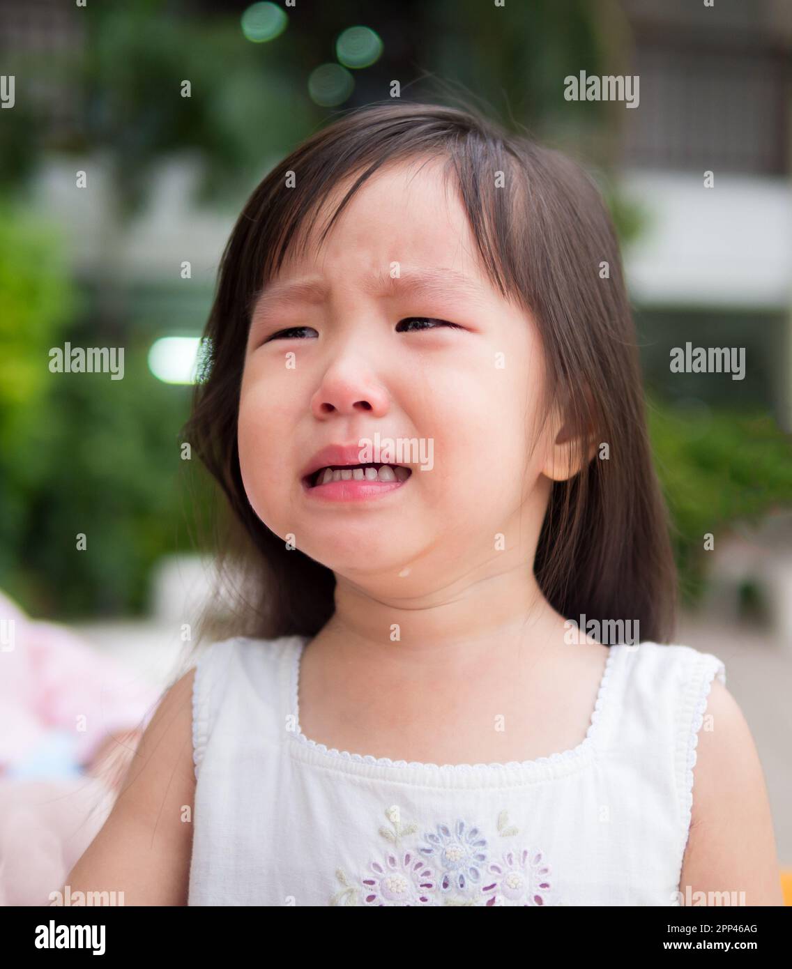 Portrait of a cute little girl , crying action Stock Photo - Alamy