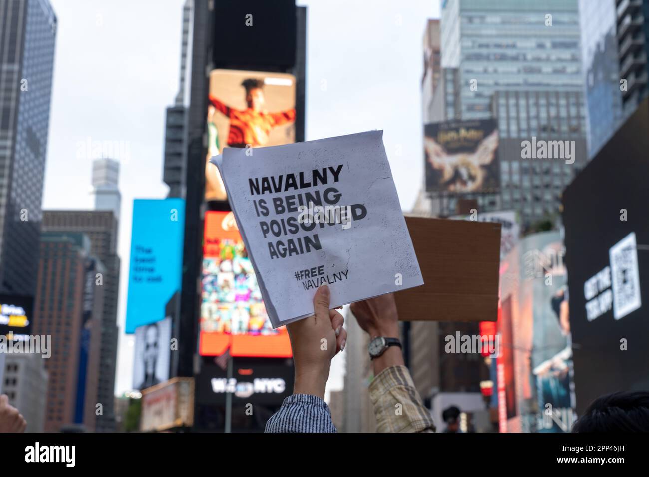 New York, United States. 21st Apr, 2023. Protesters hold placards that ...
