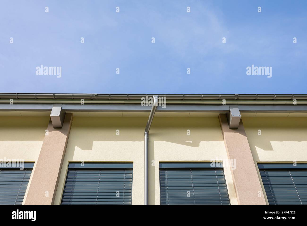 View of the upper part of the facade at the junction with the roof ...