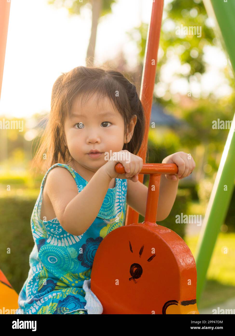 Happy kid, asian baby child playing on playground, sunset light Stock ...