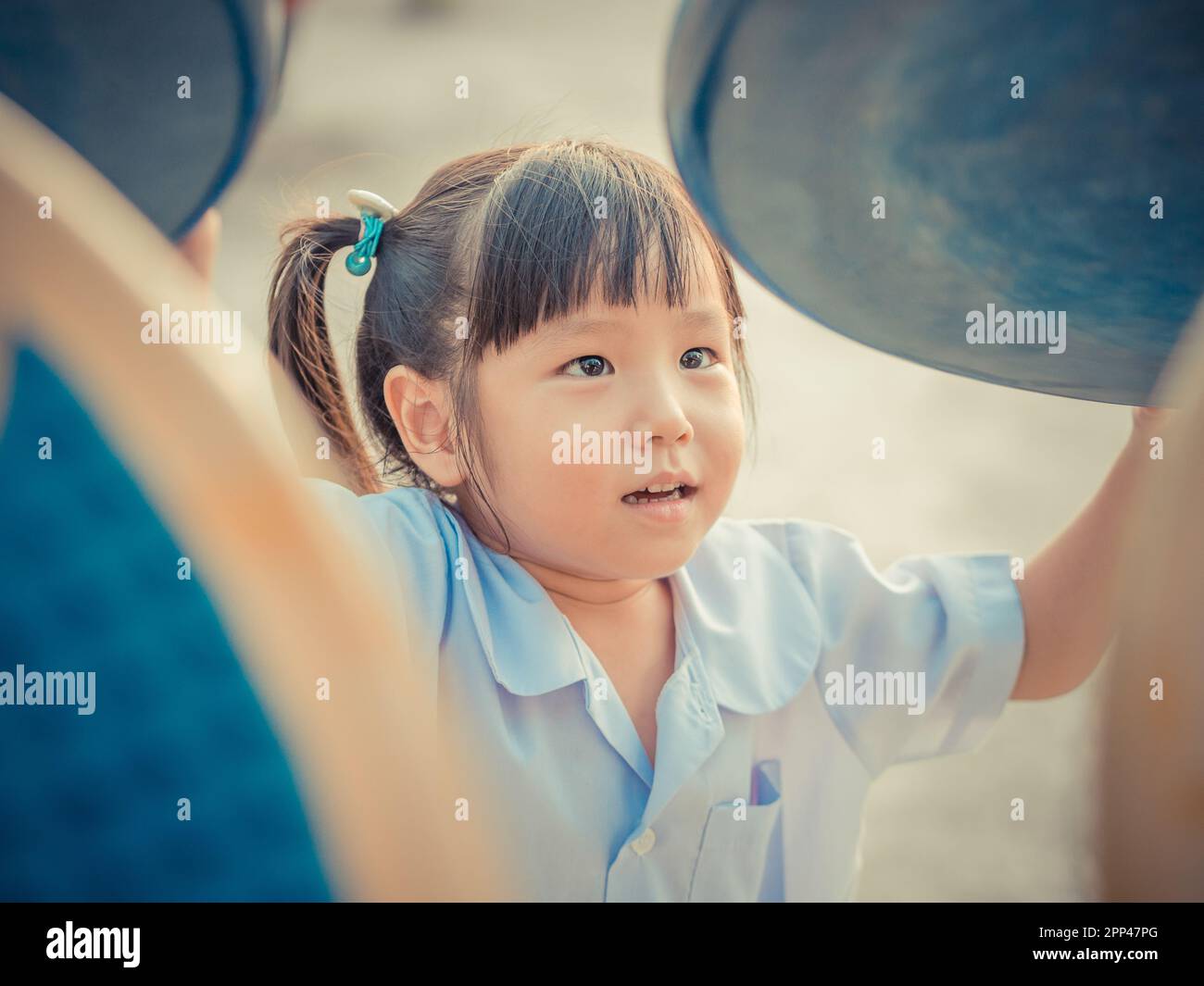 Happy kid, asian baby child in school uniform playing on playground ...