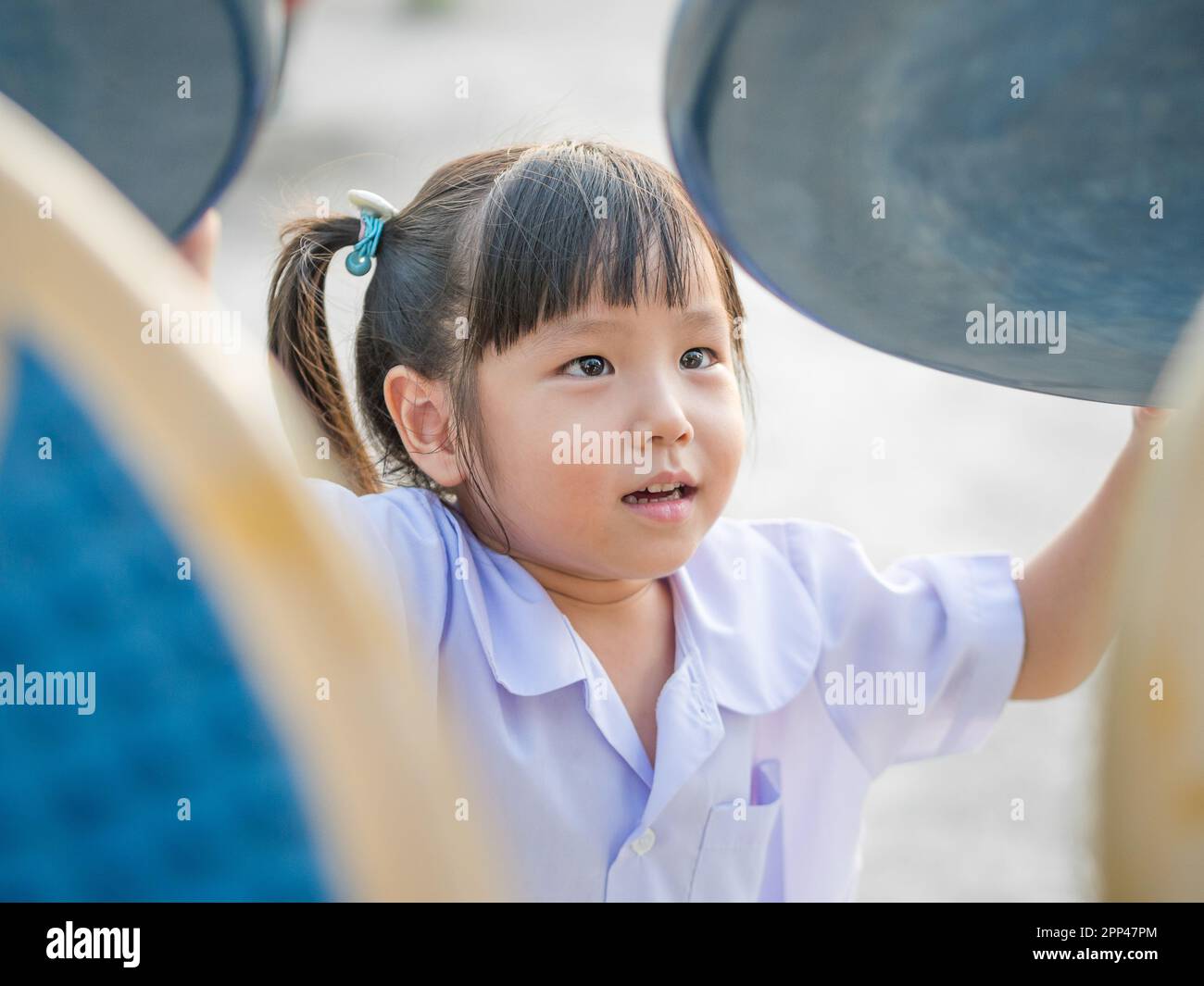 Happy kid, asian baby child in school uniform playing on playground ...