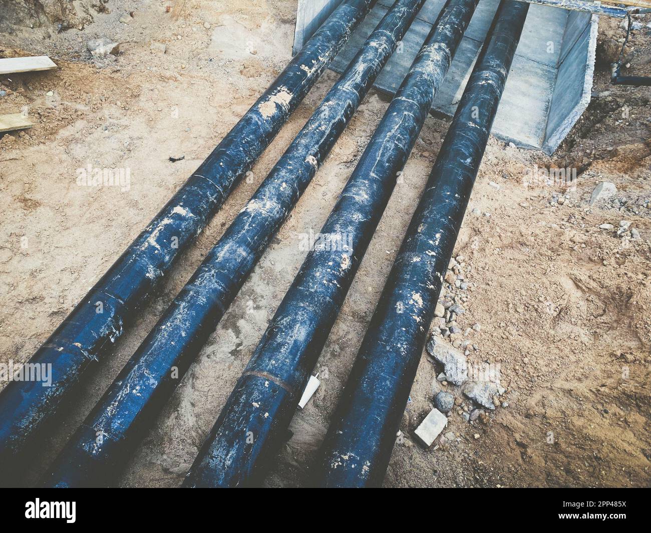 black, polypropylene, long pipes are laid underground for ...