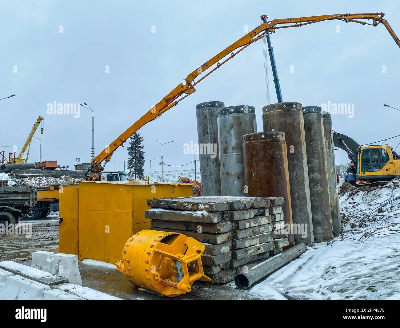 construction of a new bridge in the city center. yellow hoisting crane ...