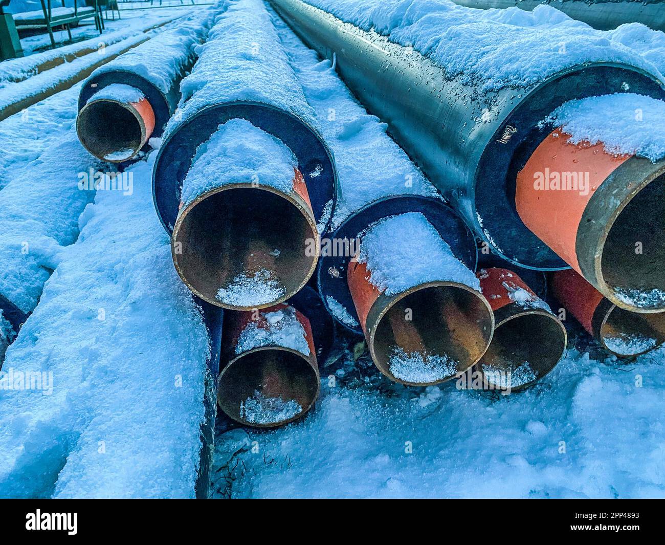 long, thin, black, narrow pipes for laying plumbing communications ...
