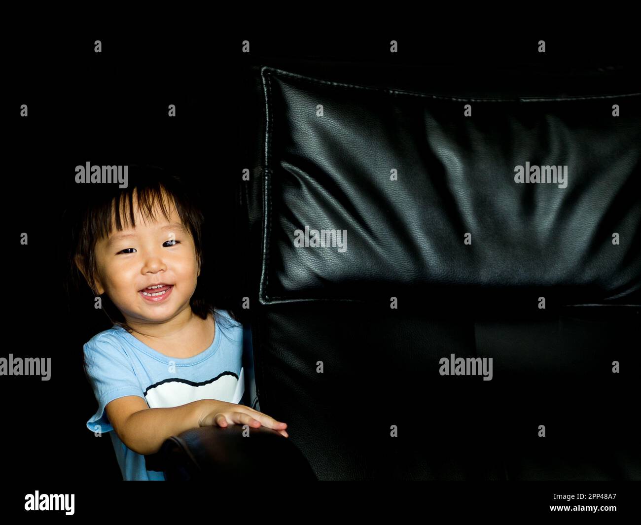 Adorable little girl playing peekaboo, asian child Stock Photo - Alamy