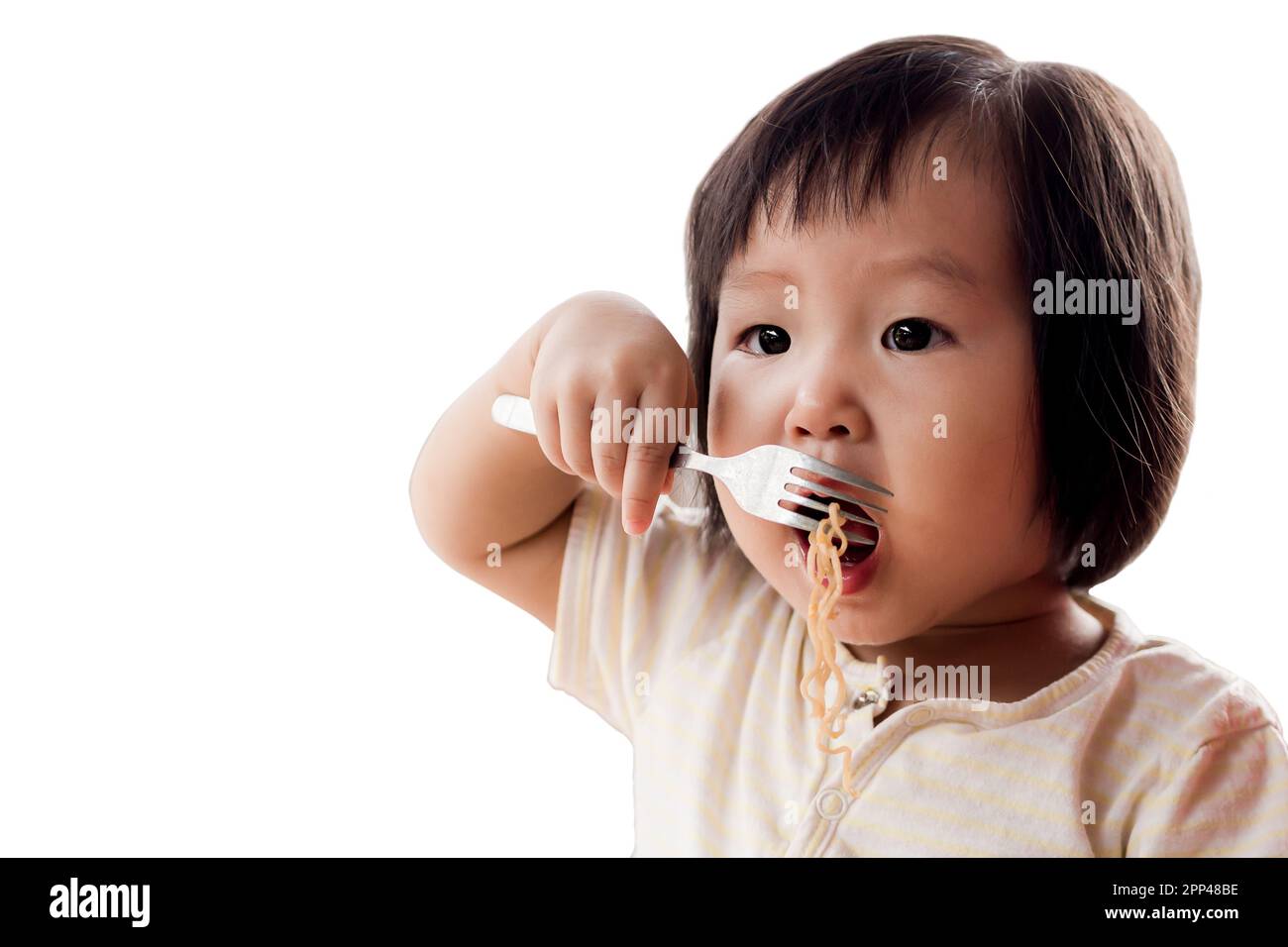 Happy Asian child eating delicious noodle Stock Photo - Alamy