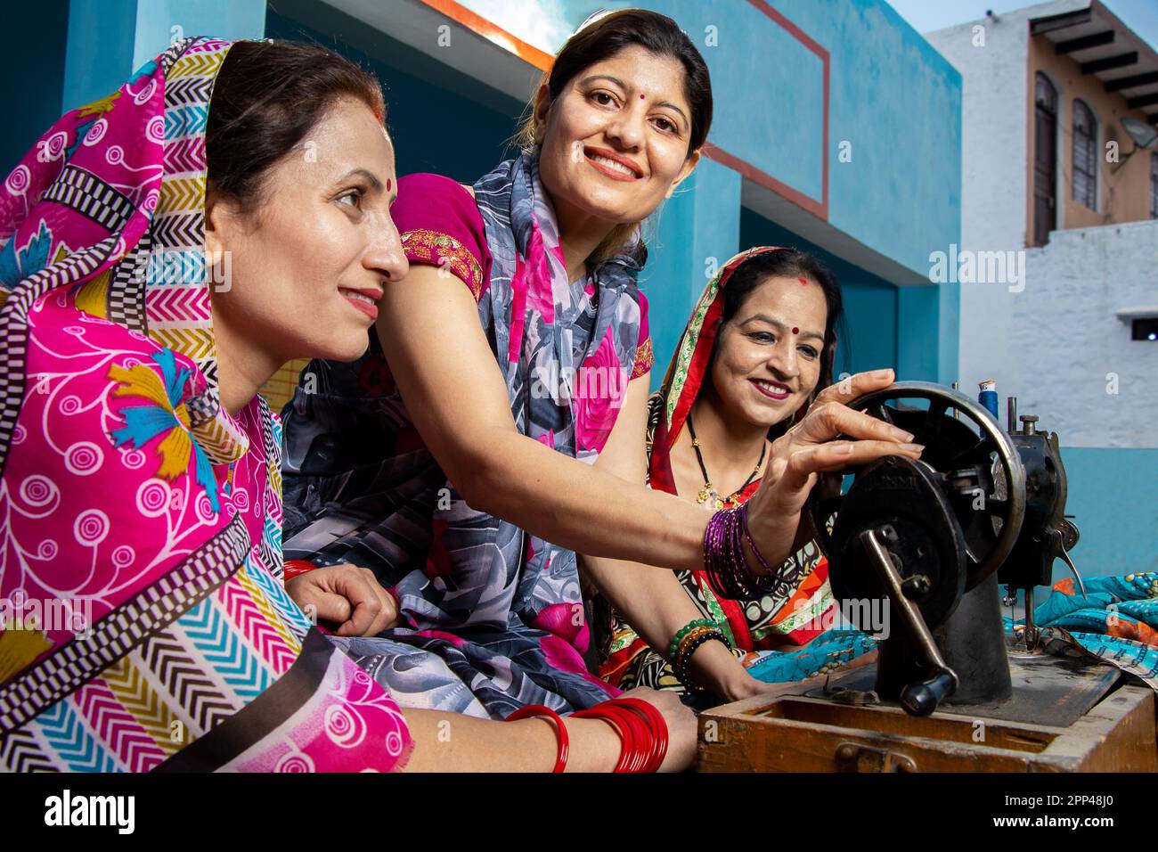 Portrait happy traditional indian woman wearing sari teaching other ...