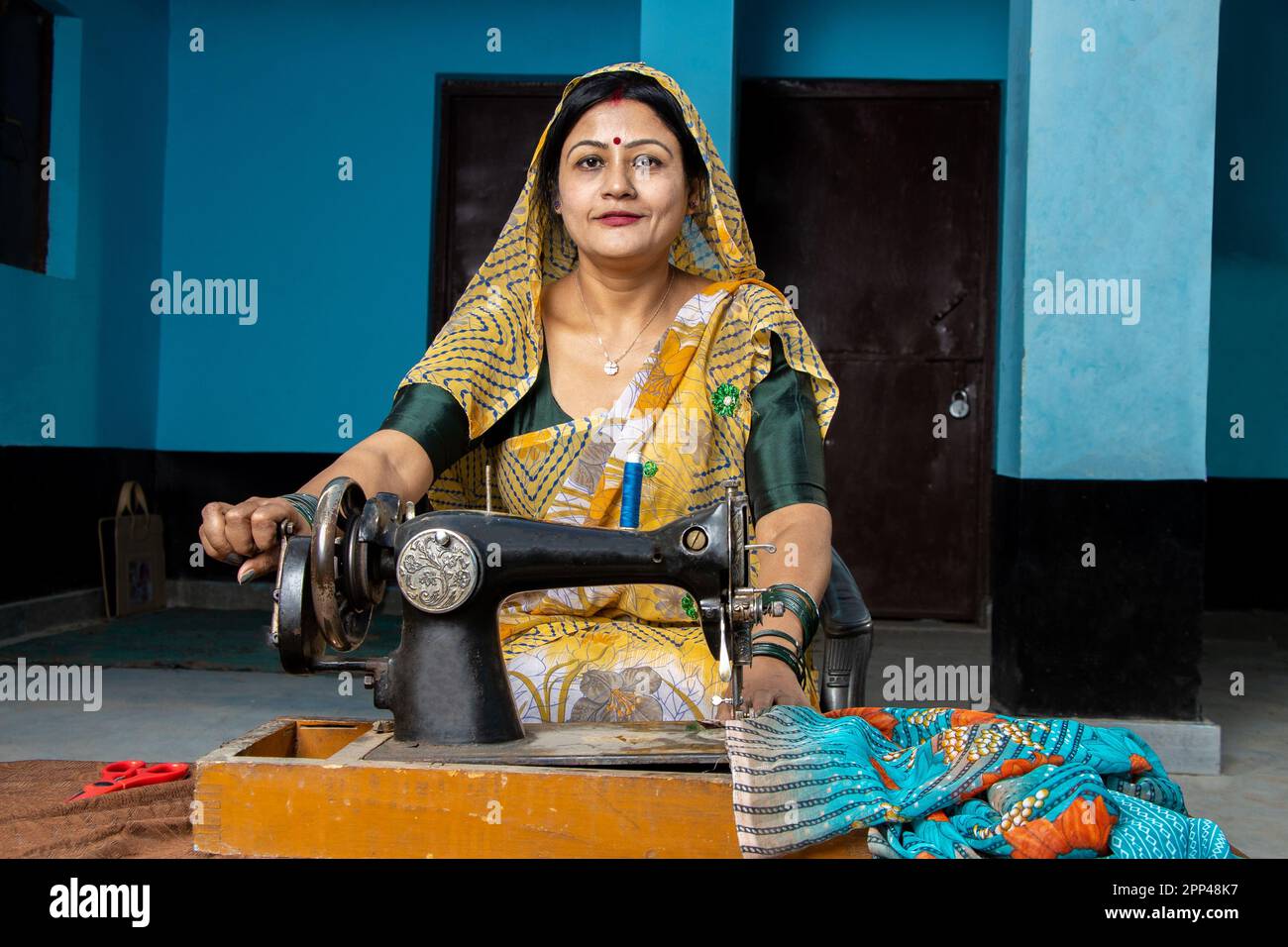 Portrait happy traditional indian woman housewife wearing sari using ...