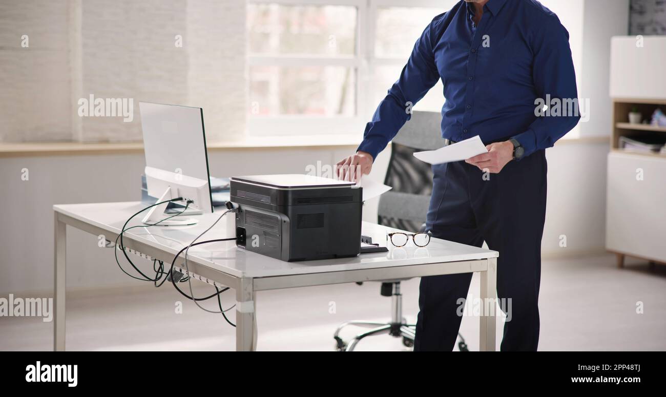 Man Using Photocopy Machine In Office. Printer And Copier Stock Photo ...