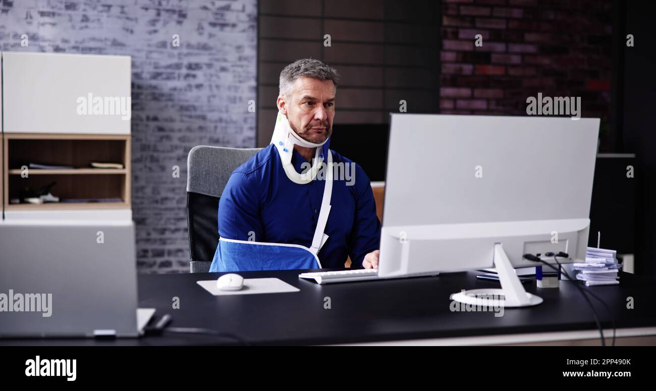 Broken Arm Injury Accident. Man In Office Using Computer Stock Photo ...