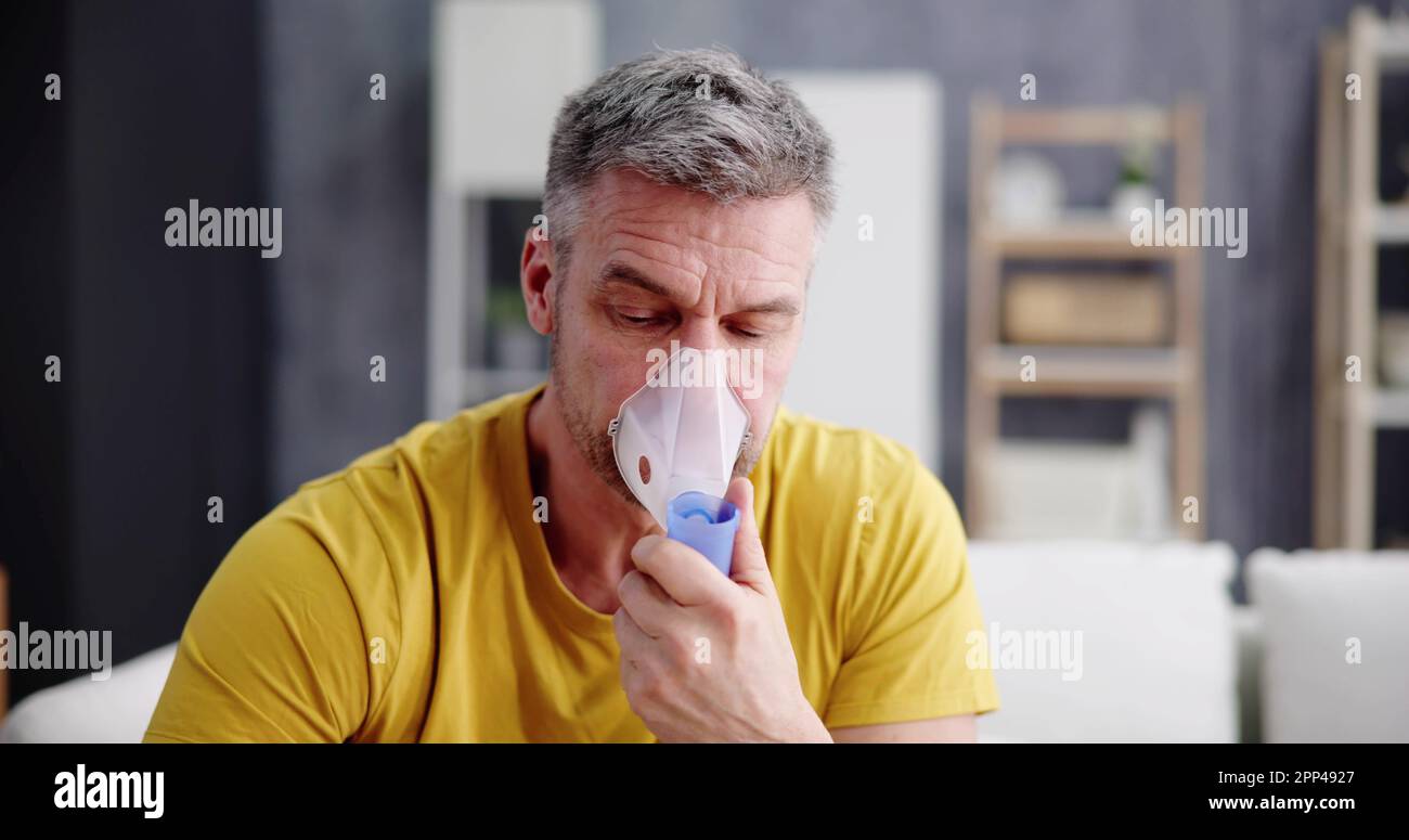 Asthma Patient Breathing Using Oxygen Mask And COPD Nebulizer Stock ...