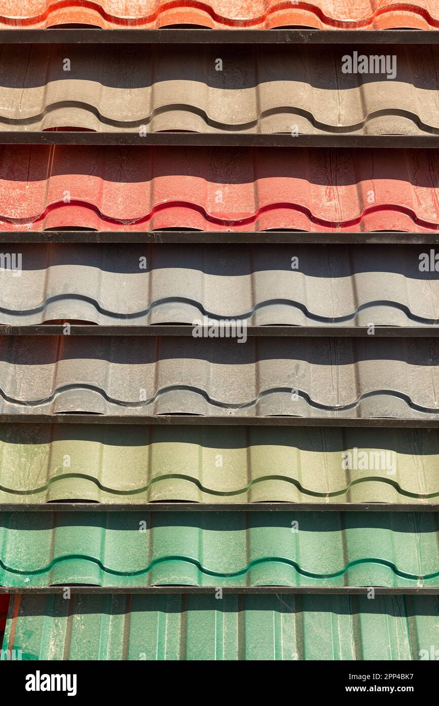 Samples of the colorful roof metal for home building. Multicolored ...