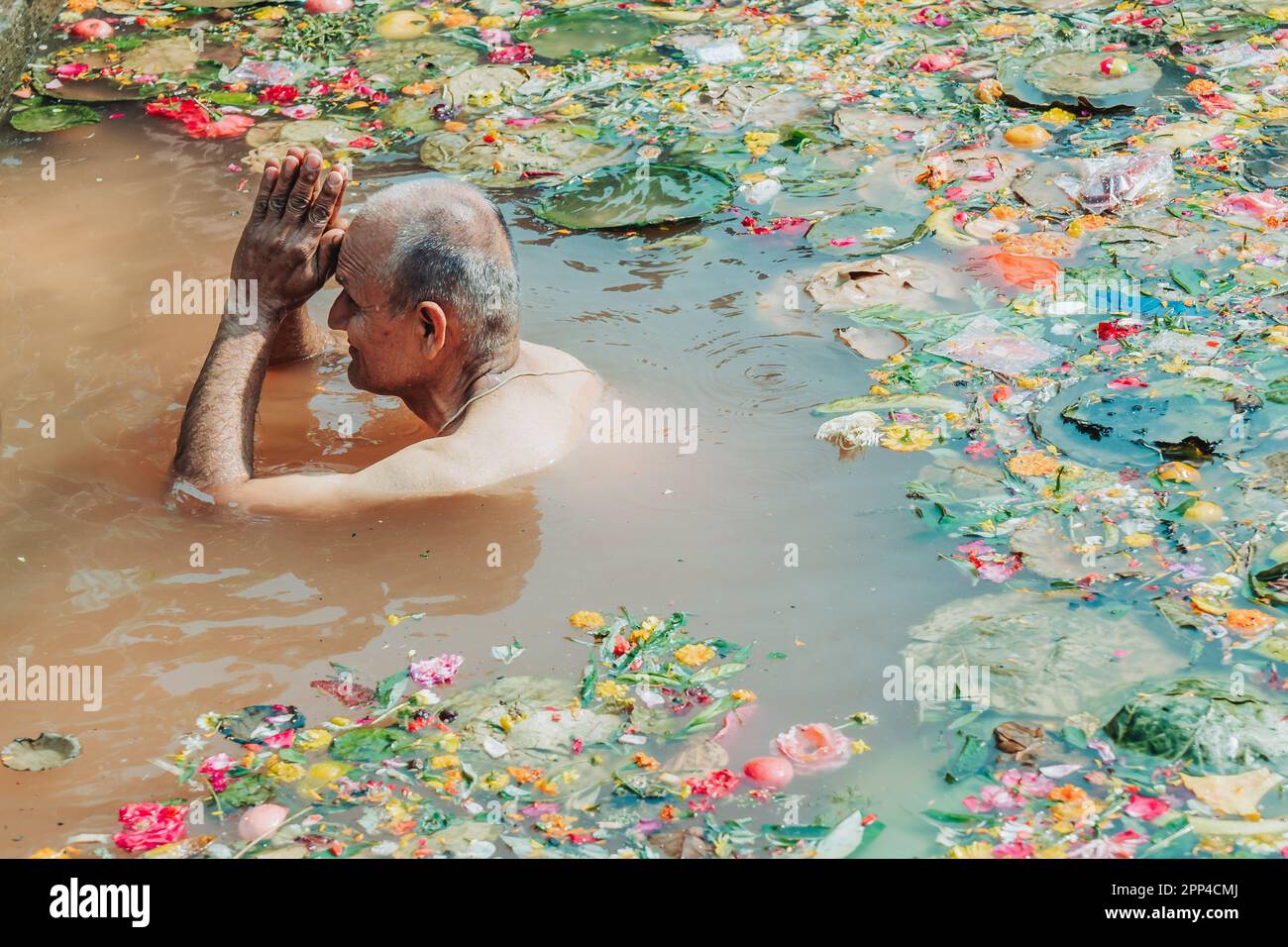 kathmandu, Nepal - April 20, 2023 : Devoted Hindu man taking a holy ...