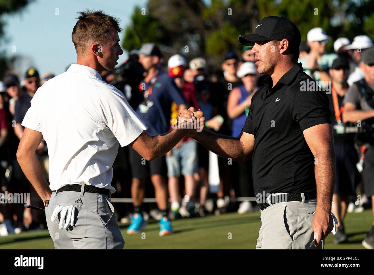 David Puig of Torque GC shakes hands with Captain Brooks Koepka of ...
