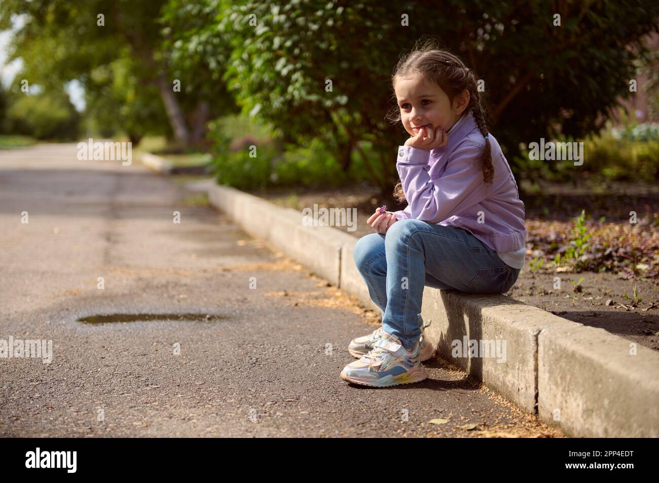 Full length portrait Caucasian pensive little kid girl in casual denim ...