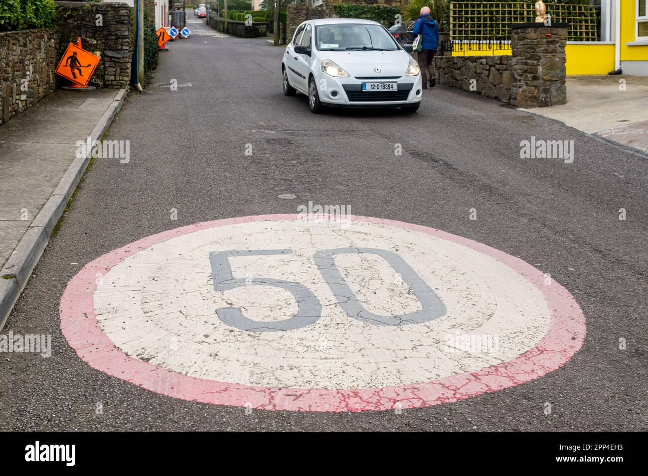 Car passing 50 KMH sign in the road in Ireland Stock Photo - Alamy