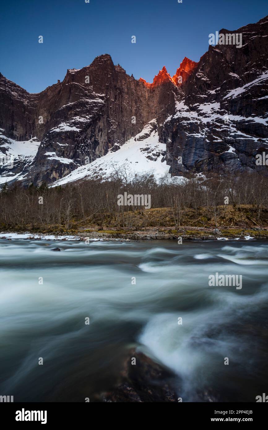 Early morning alpenglow on the peaks Trolltindene and the Trollveggen ...