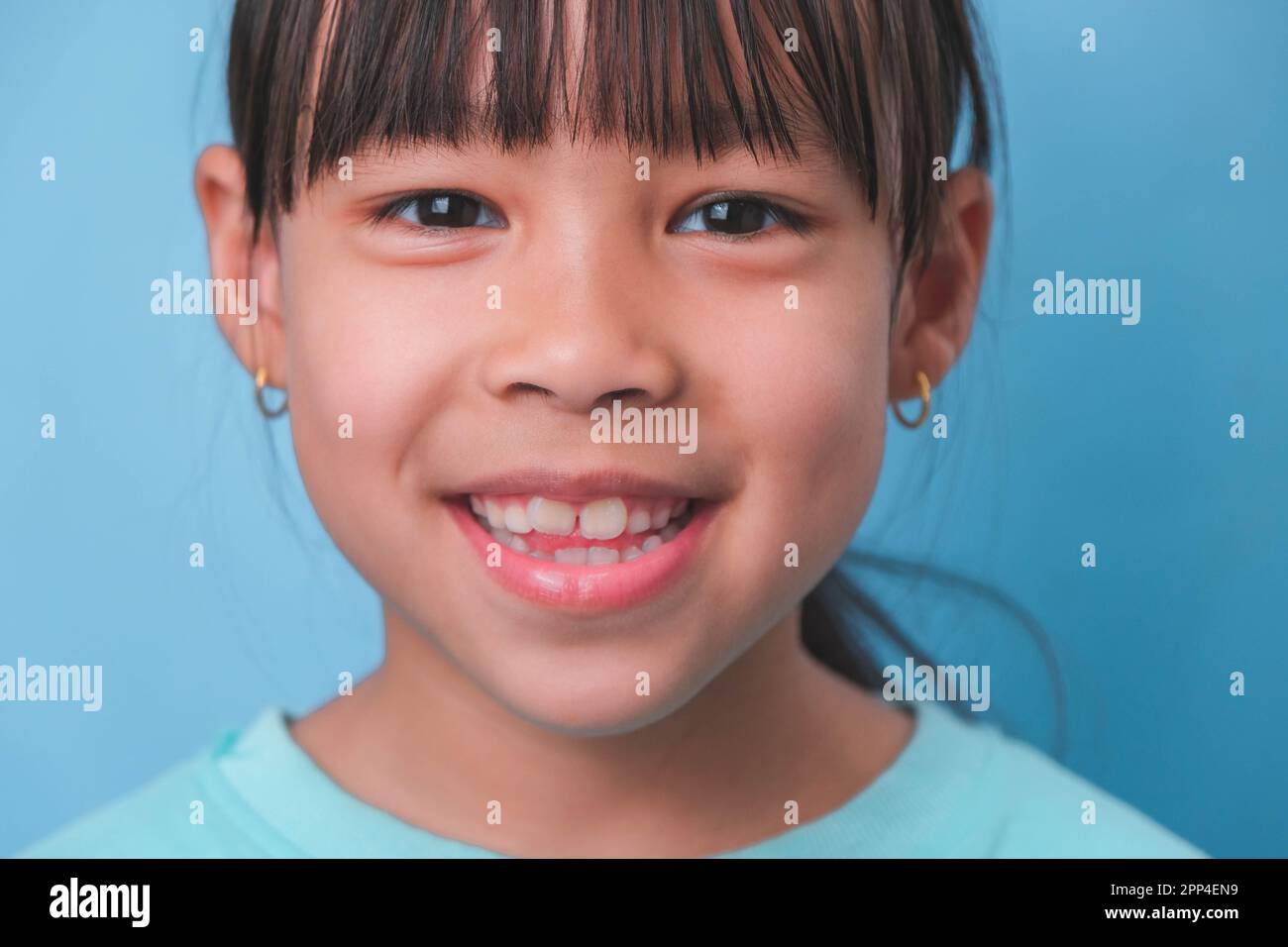 Close-up of smiling young girl revealing her beautiful white teeth on a ...
