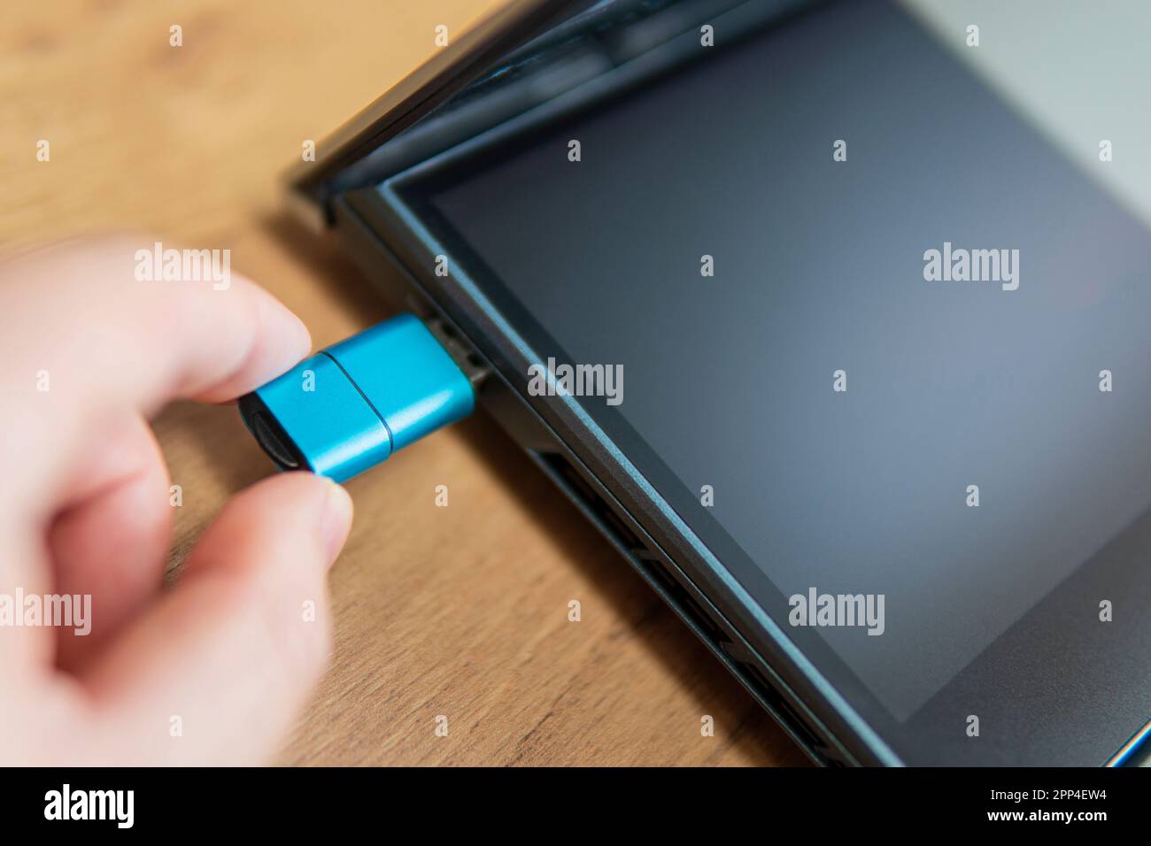 Hand inserting USB flash drive into computer laptop. data transmission Stock Photo - Alamy