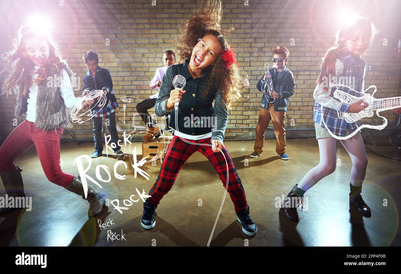 Rocking it out. children singing and playing rock music on imaginary ...