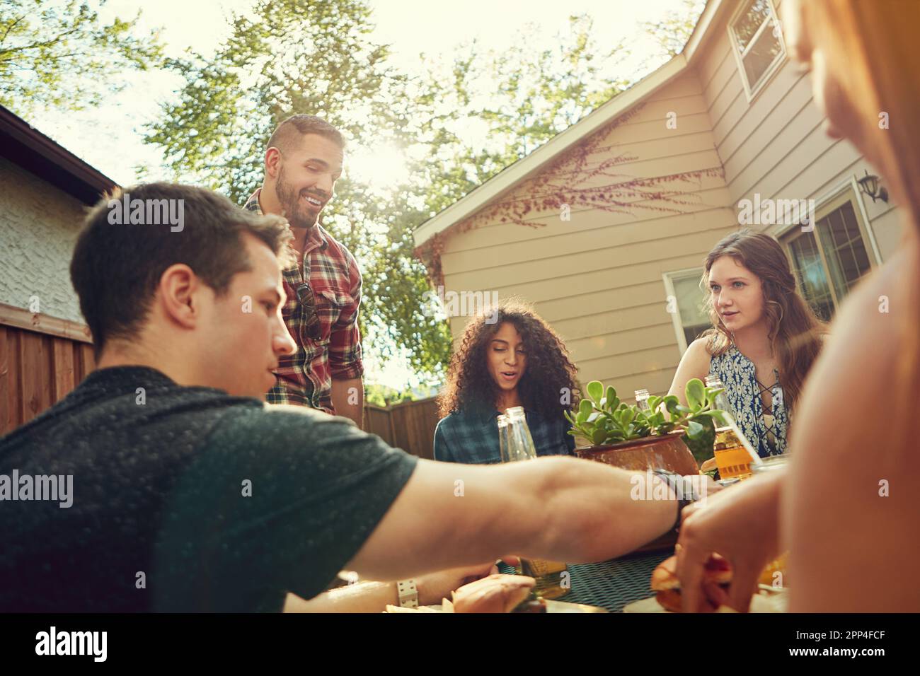 Summerthe season for socializing. a group of friends having lunch in ...