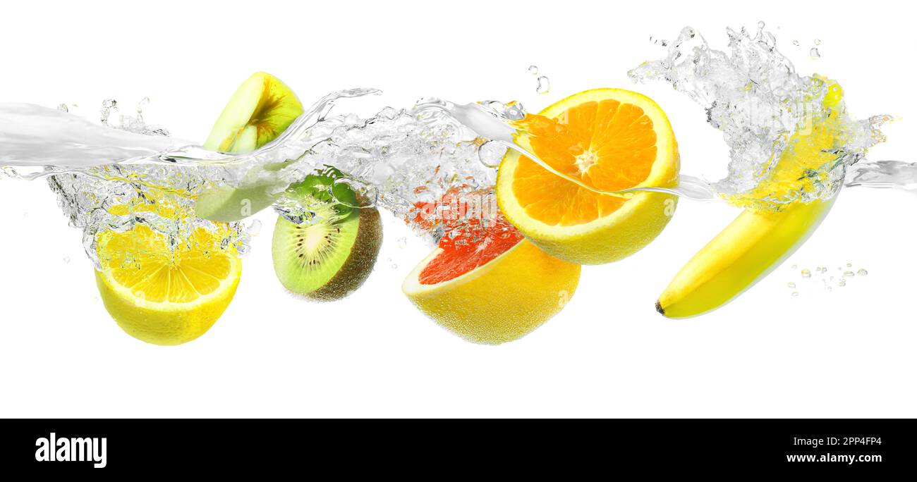 Fruits mix splashing into clear water on white background Stock Photo ...