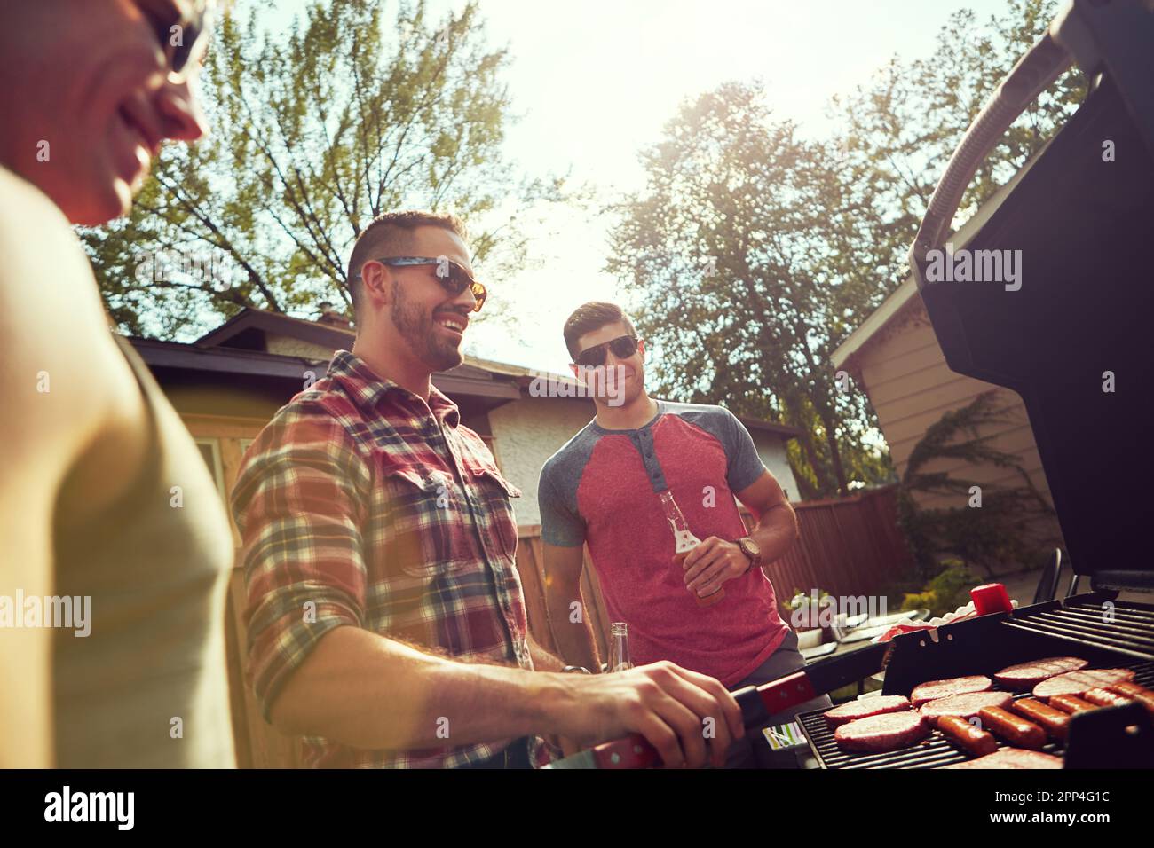 Happiness is a BBQ with great mates. a group of friends having a ...