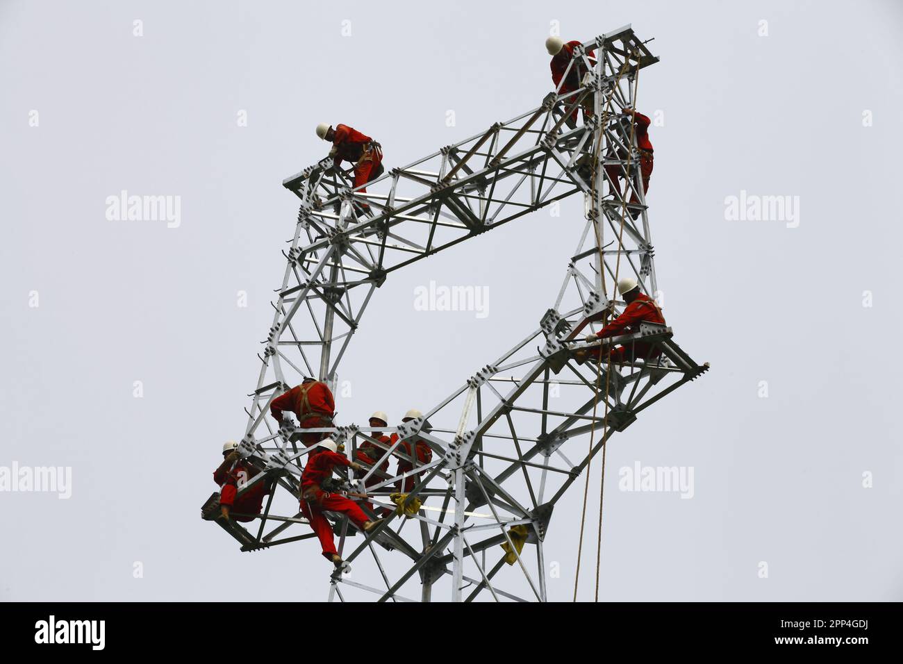 The workers of the pylon Stock Photo - Alamy