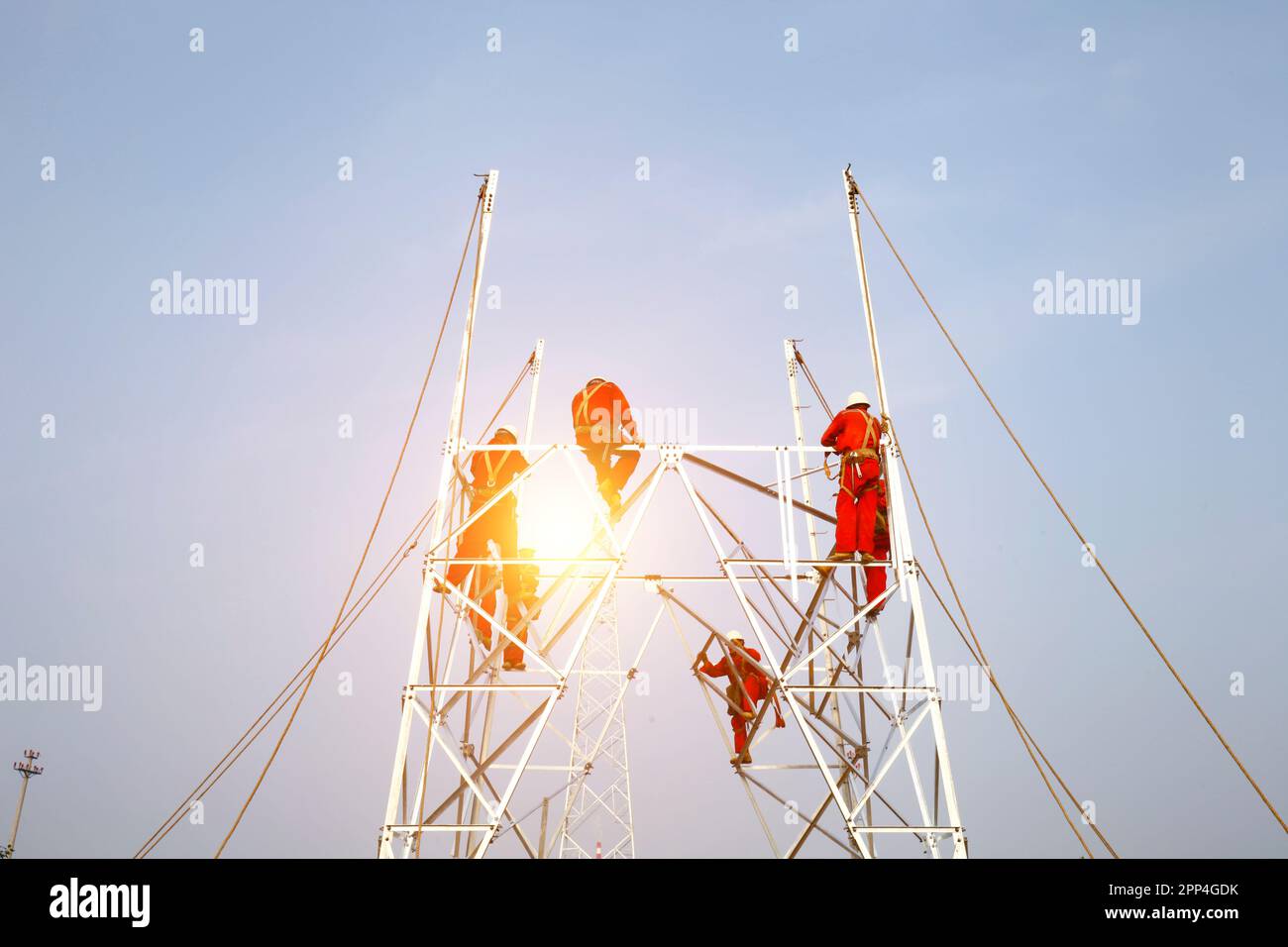 The workers of the pylon Stock Photo - Alamy