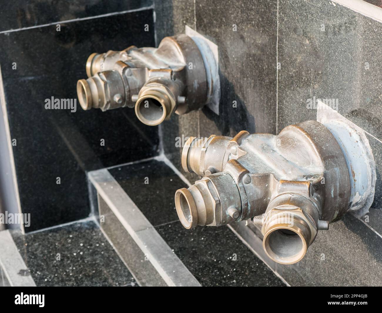 Wall mounted fire hydrant for emergency use Stock Photo - Alamy