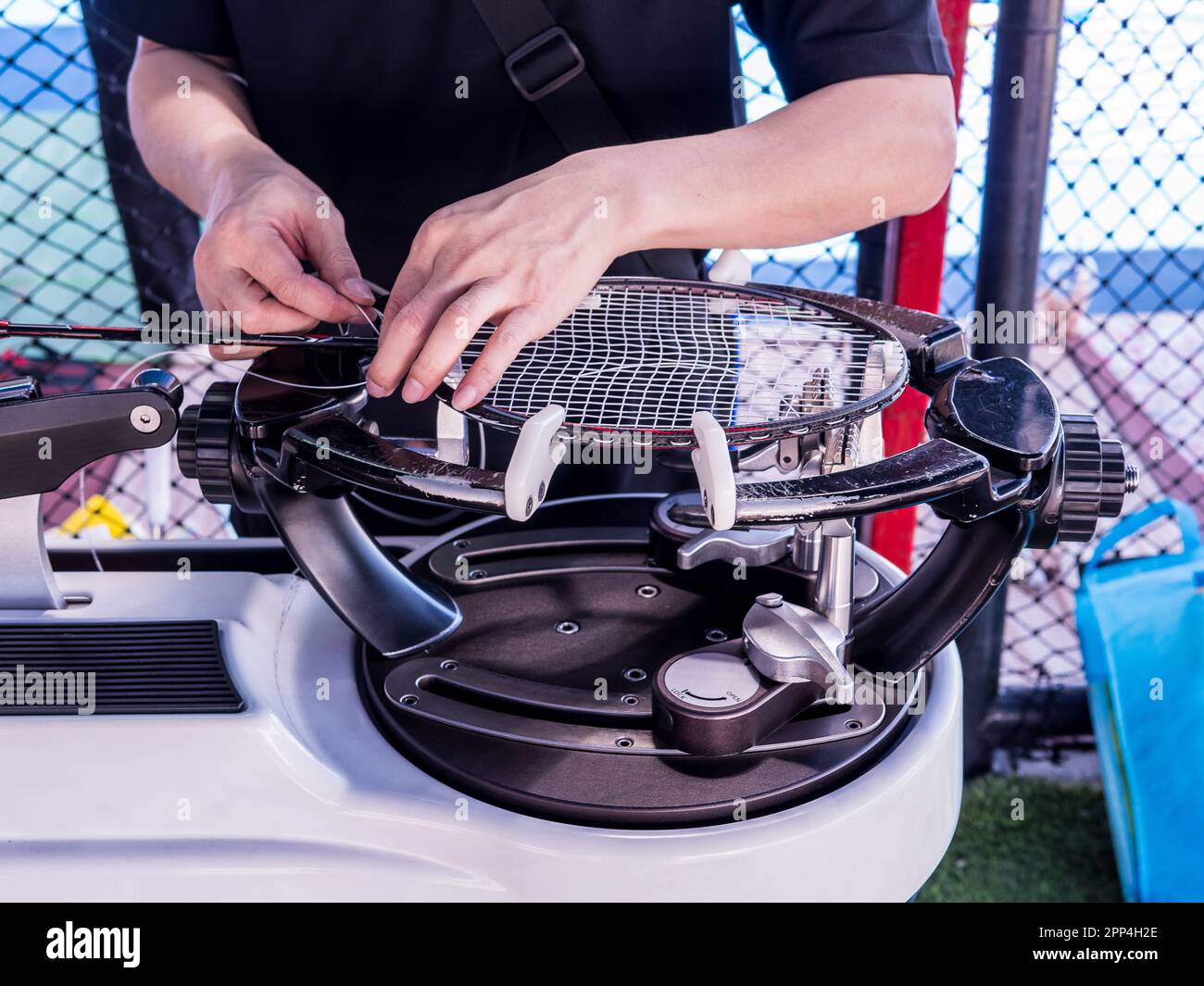 weaving, Stringing badminton racket on racquet weaving machine Stock ...