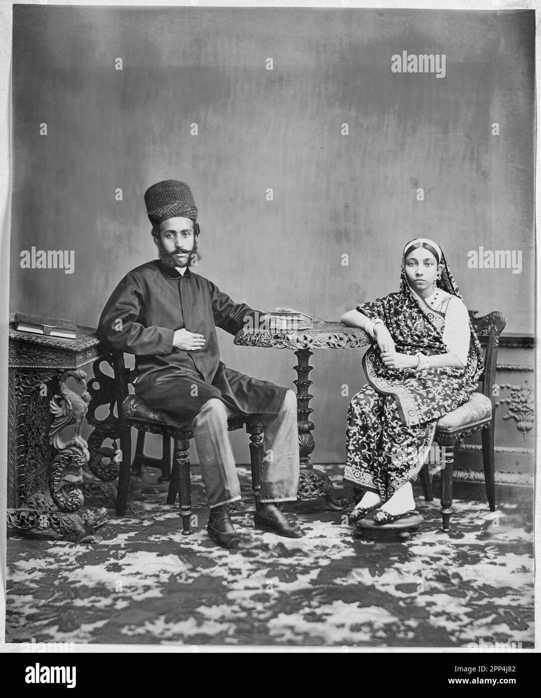 Parsee group. About 1865. Studio portrait of a man and a woman sitting ...