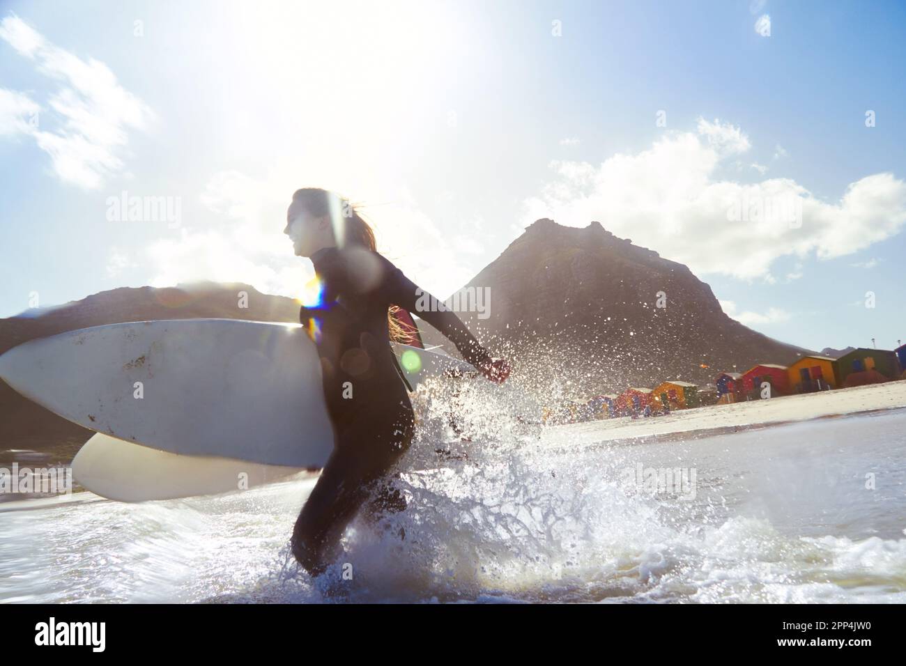 The ocean is their playground. a young couple out surfing together ...