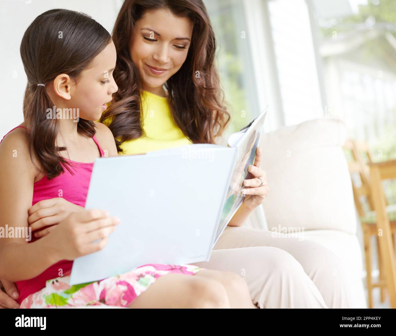 What does this word mean Mum. A mother and daughter reading a book ...