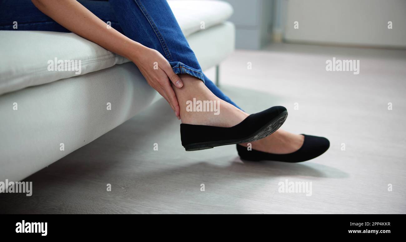 Uncomfortable Shoes Blister Pain. Woman With Sore Feet Stock Photo - Alamy