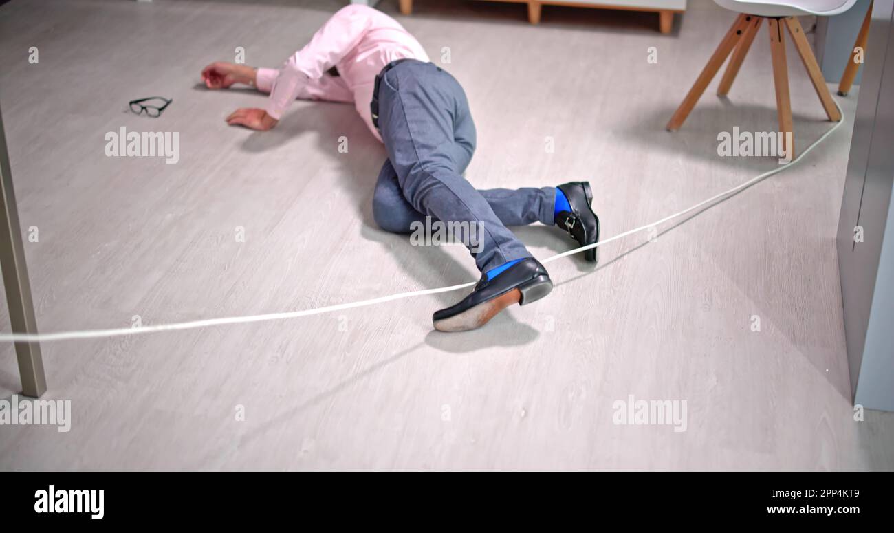 Wire Cord Trip Over And Fall. Feet Stumble On Cable Stock Photo - Alamy