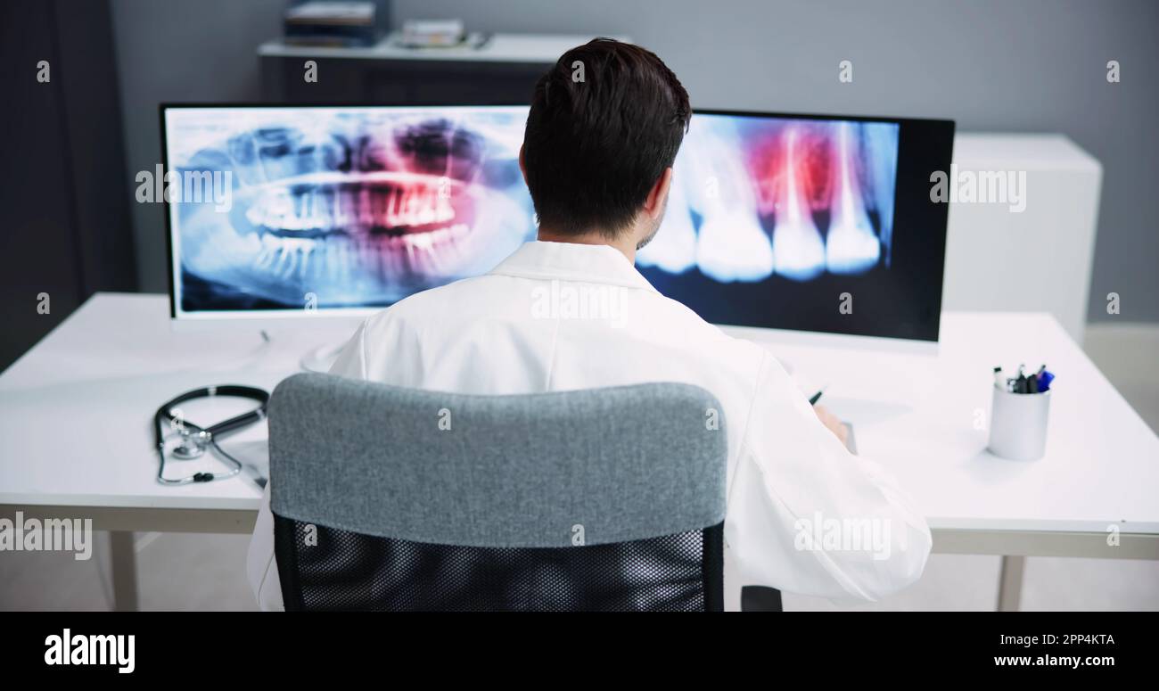 Radiologist Dentist Using X Ray Software On Desktop Computer Stock ...