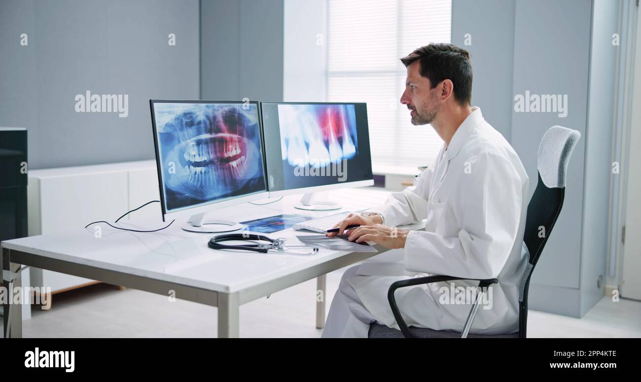 Radiologist Dentist Using X Ray Software On Desktop Computer Stock ...