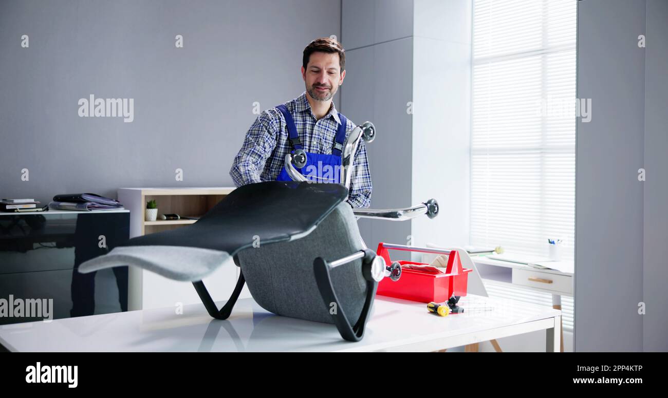 Office Chair Assembling And Repair. Man Working With Tool Stock Photo ...