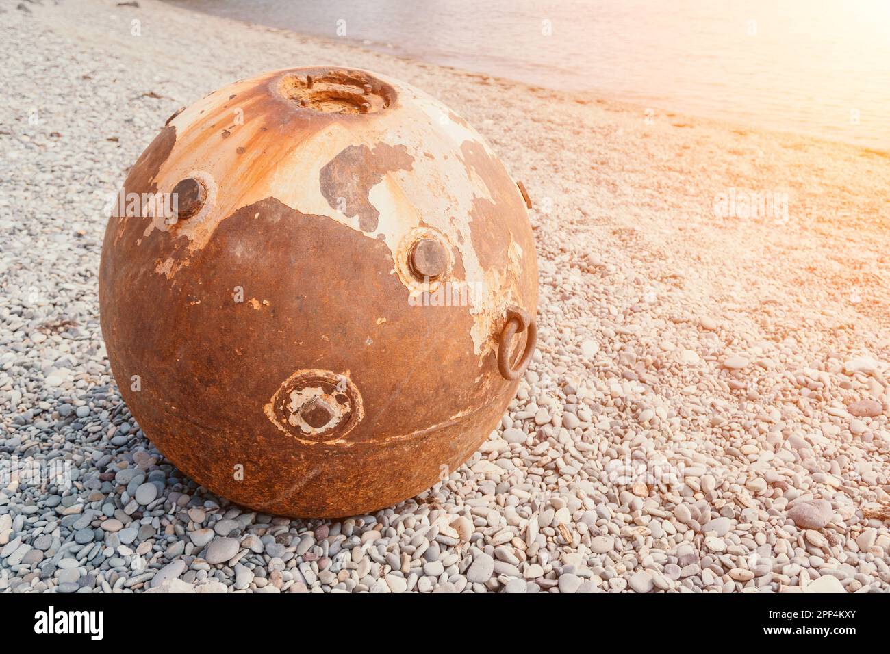 Old rusty sea mine on the beach Stock Photo - Alamy