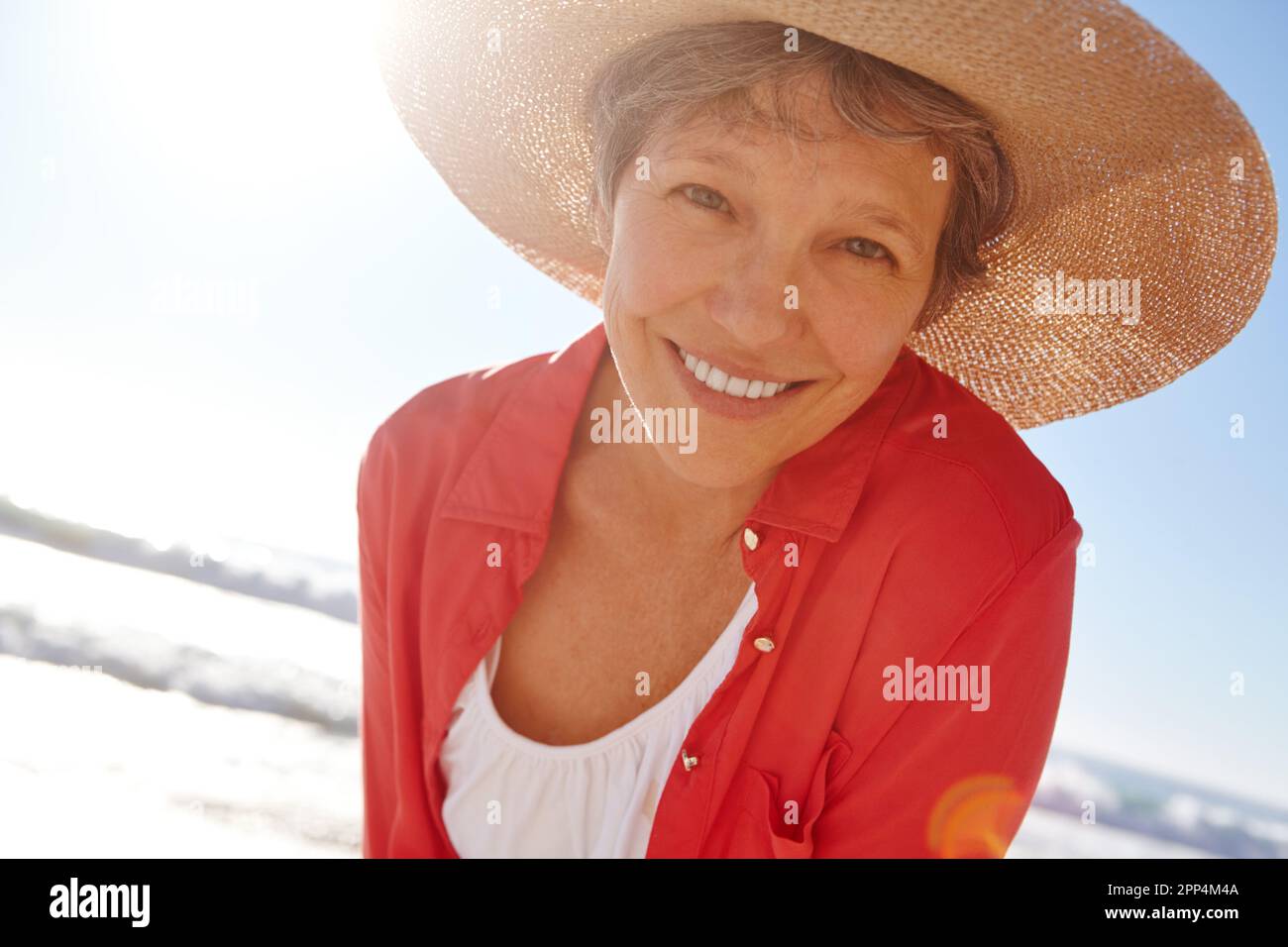 Another perfect day in paradise. Portrait of an attractive mature woman ...