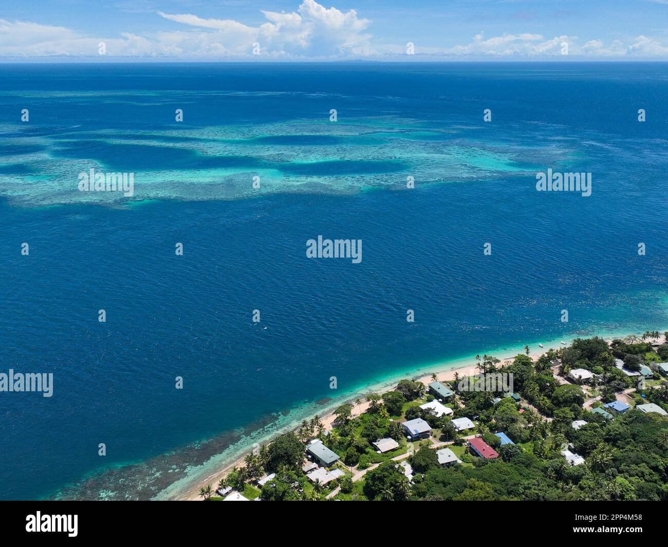 Aerial view of lush island showing tropical lving in the Torres Strait ...