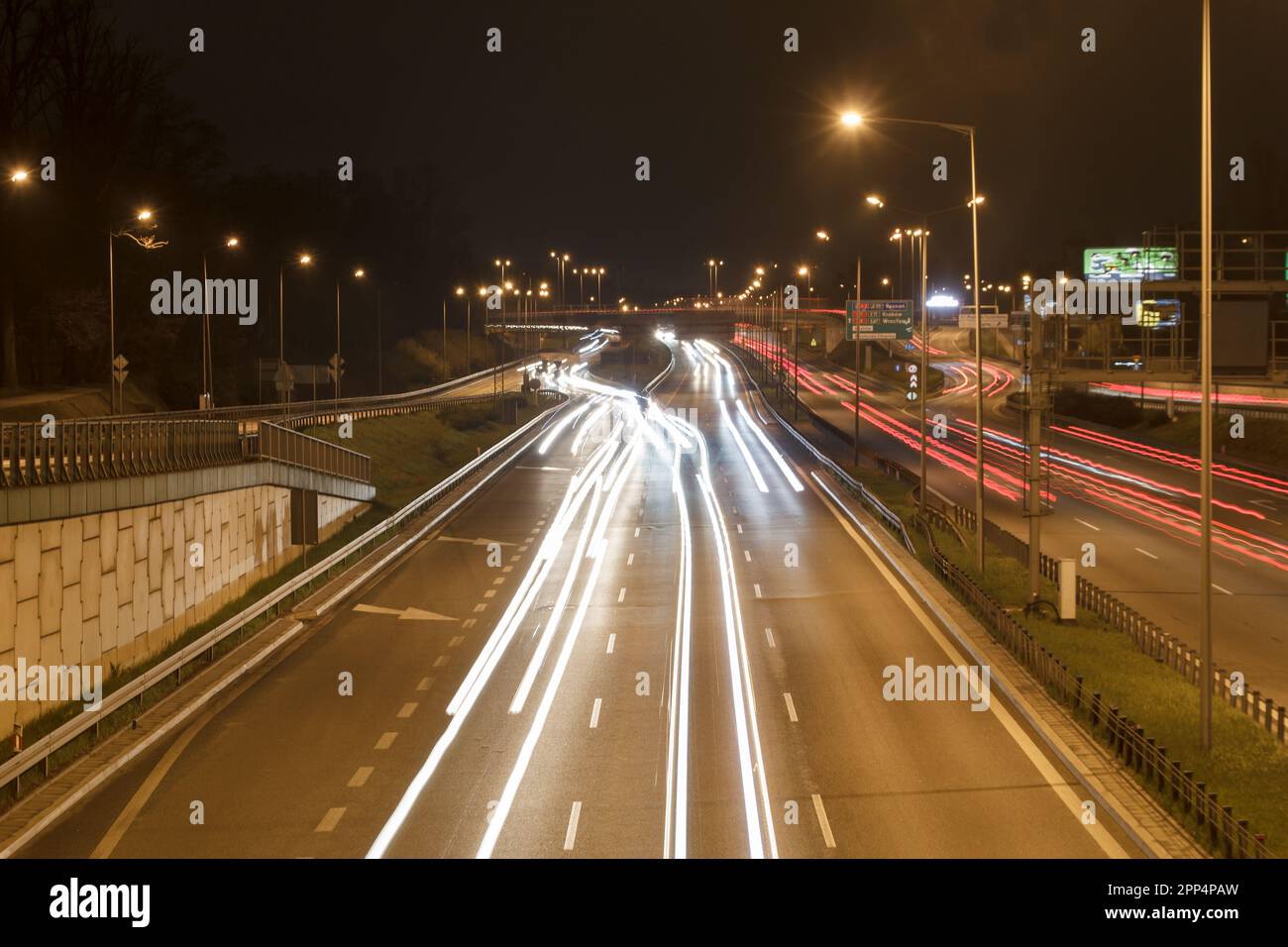highway intersection by night with lights blurred Stock Photo - Alamy
