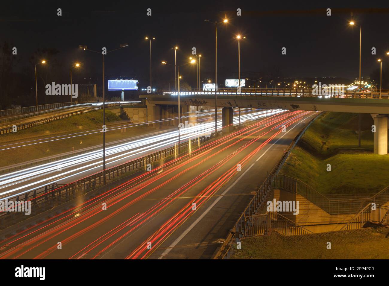 highway intersection by night with lights blurred Stock Photo - Alamy