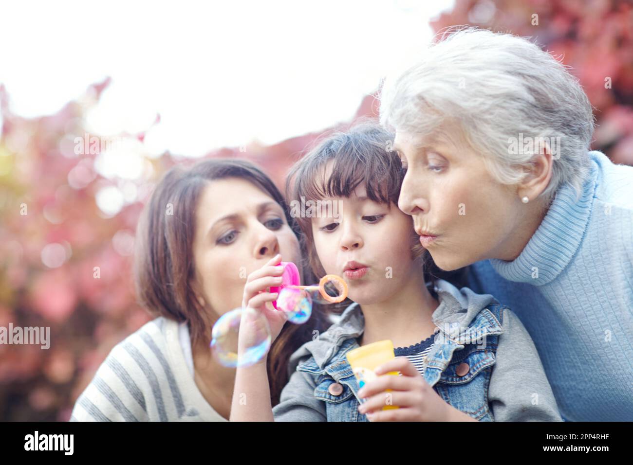 Grandmother blowing bubbles playing hi-res stock photography and images - Alamy