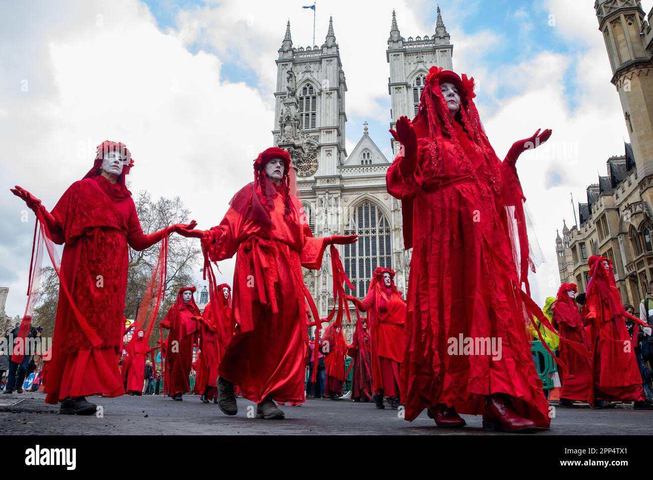 London, UK. 21st April, 2023. Extinction Rebellion Red Rebels pass ...